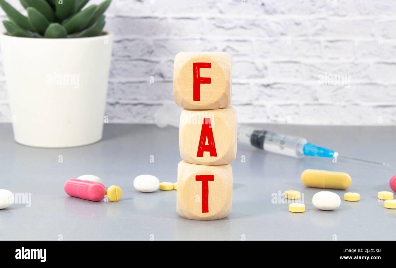 Fat word on wooden blocks. Healthy or unhealthy food concept Stock ...