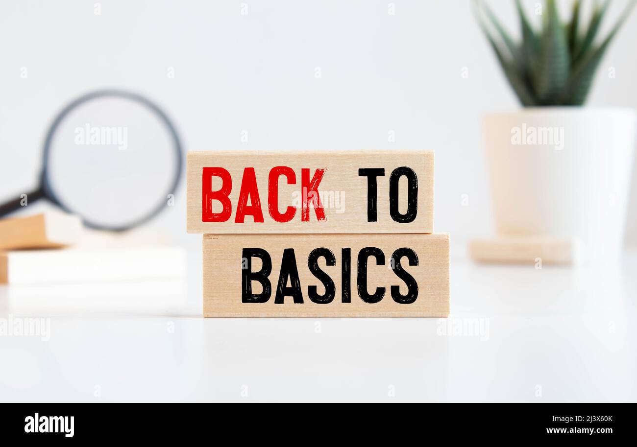back to basics word written on wood block. back to basics text on table ...