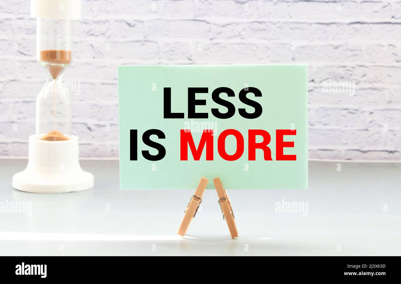 Text less is more on the short note texture background Stock Photo - Alamy