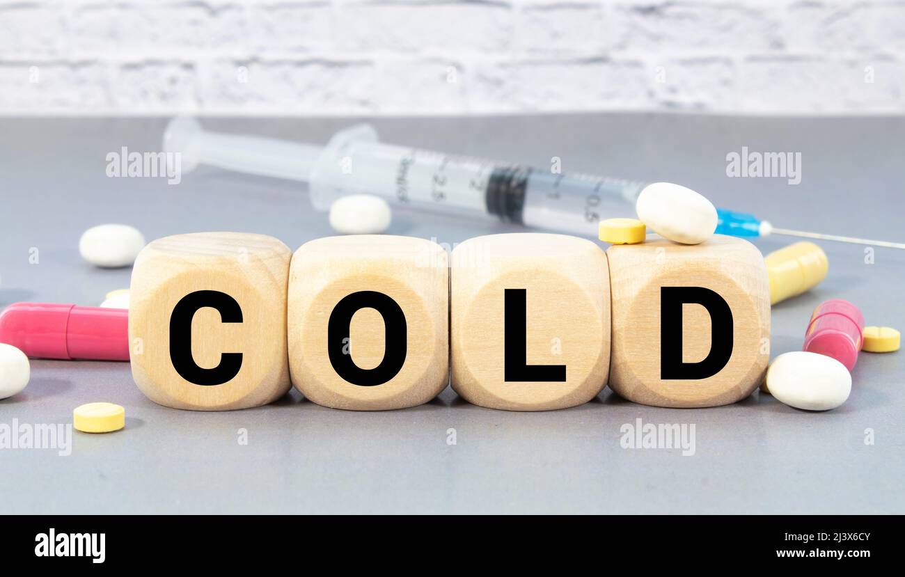 COLD - words from wooden blocks with letters, feel worried and nervous ...