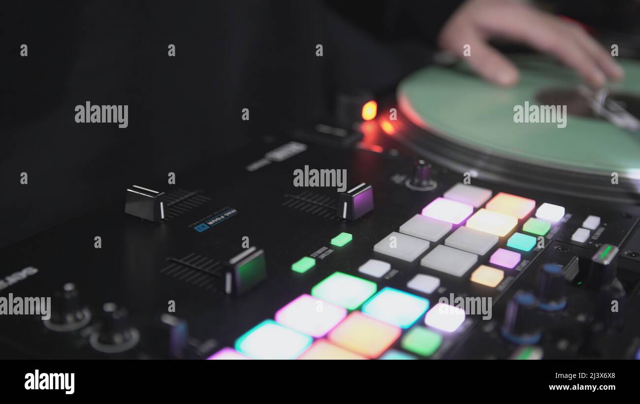 Click colored squares on mixer panel. ART. Hands in dark room are ...