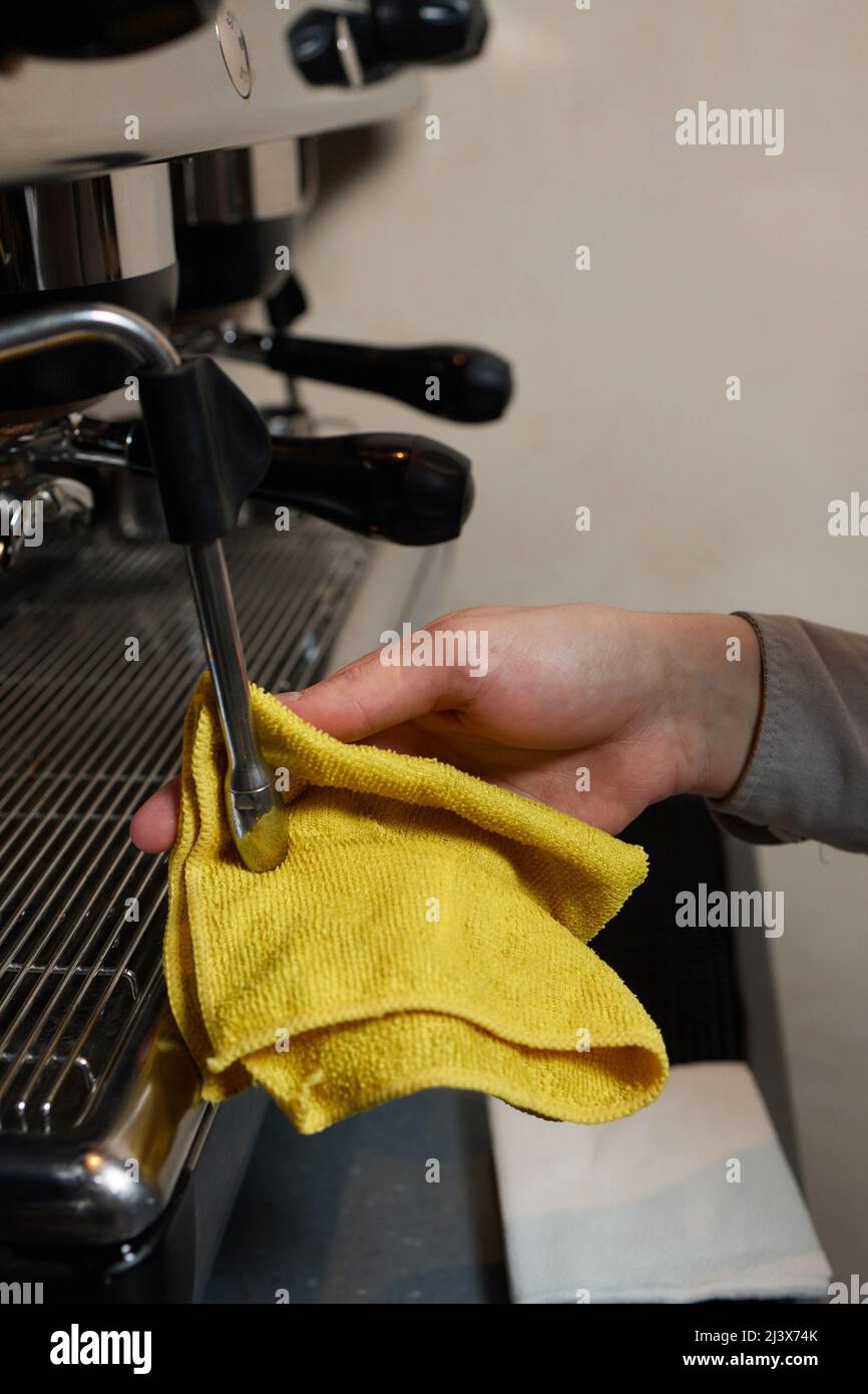 A perfectly lit cleaning cloth sat upon an espresso machine Stock Photo ...