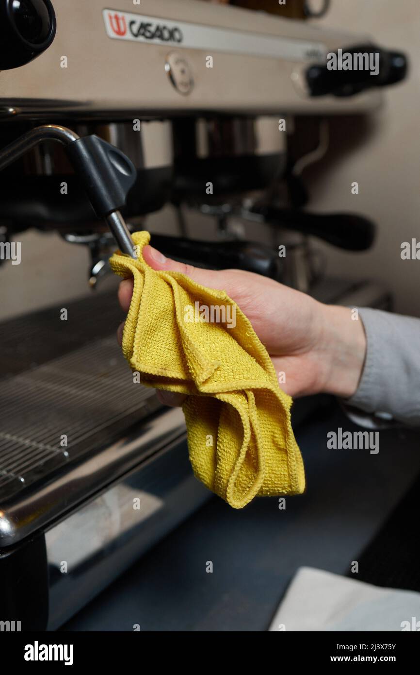 A perfectly lit cleaning cloth sat upon an espresso machine Stock Photo ...
