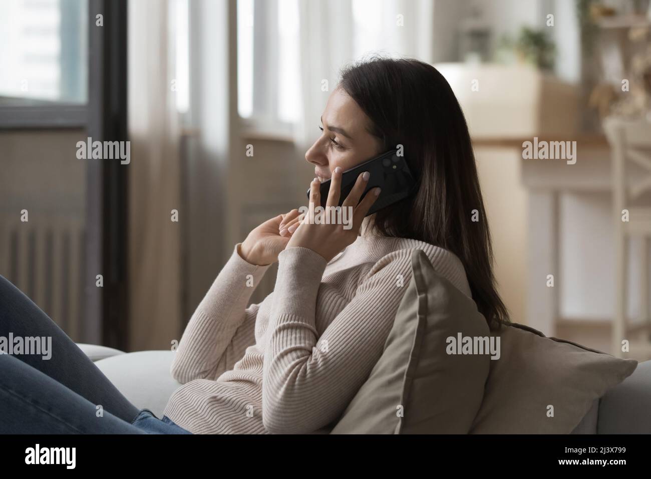 Happy millennial cell user woman speaking on mobile phone Stock Photo ...