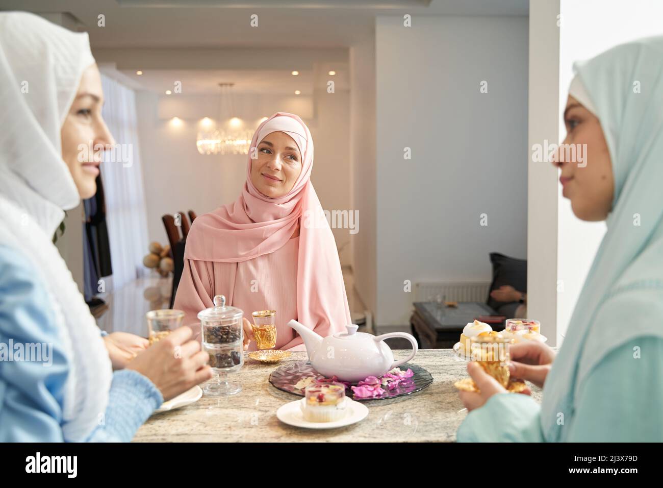 Small group of Muslim women meeting at home Stock Photo - Alamy