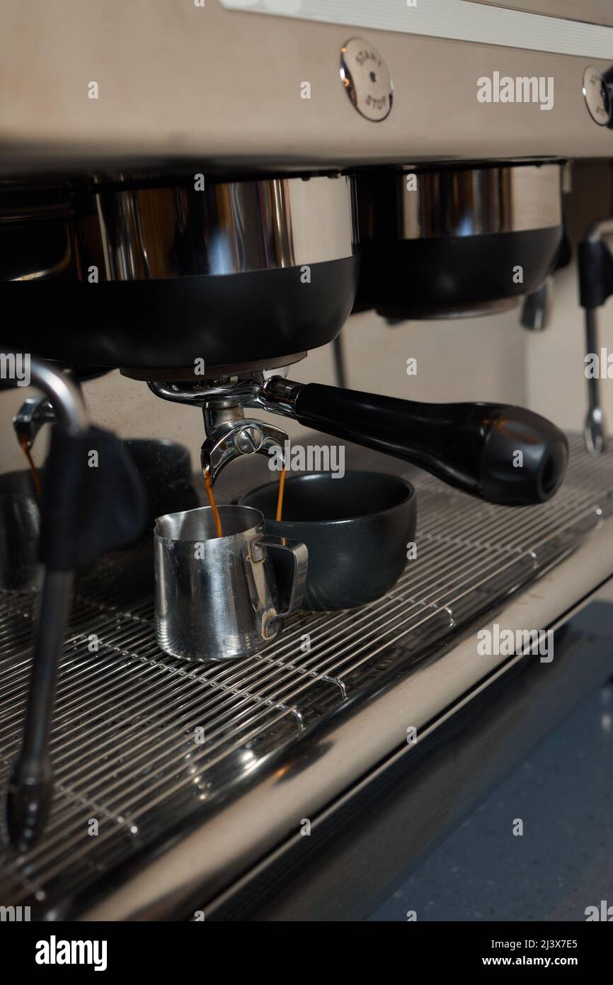 espresso shot from coffee machine make by barista in coffee shop cafe ...