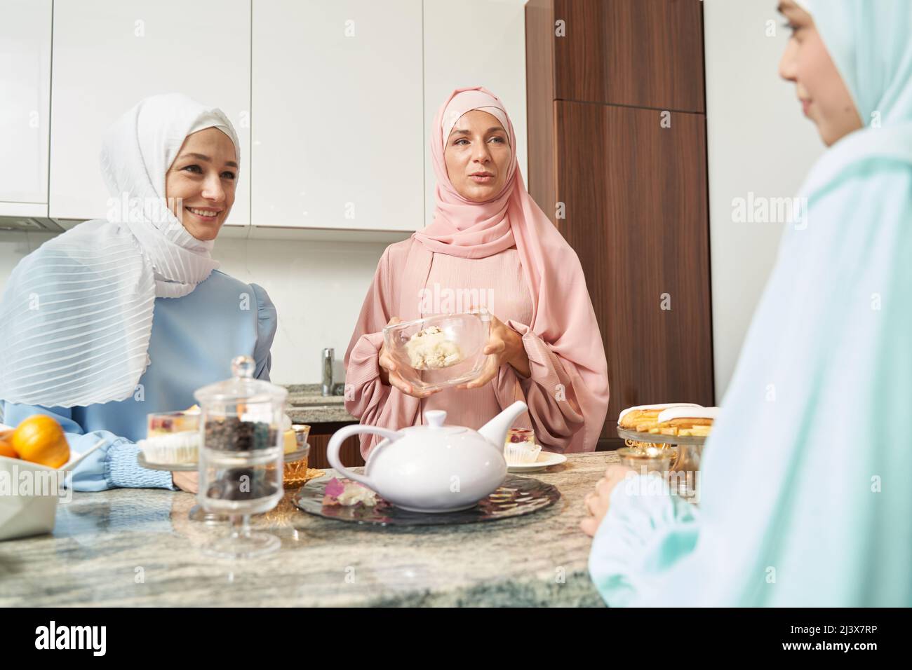 Religious women spending time in the kitchen with desserts Stock Photo ...