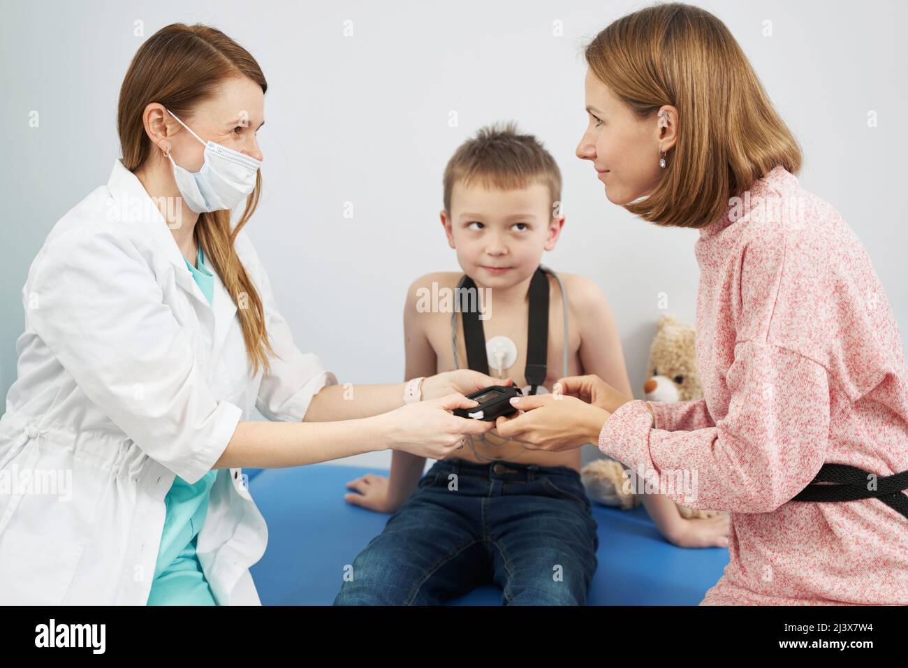 Pediatrician checking child heart rhythm with ECG holter monitor Stock ...