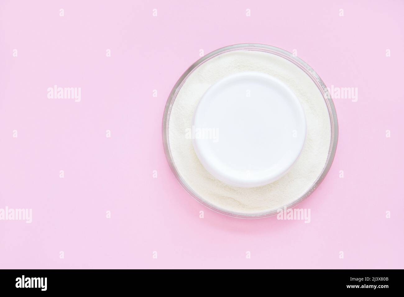 Collagen white powder. Pastel color background. Health product. Woman ...