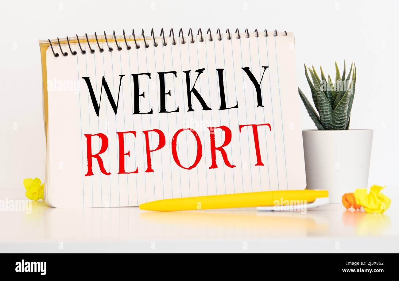 weekly report - text written in notebook on financial charts Stock ...