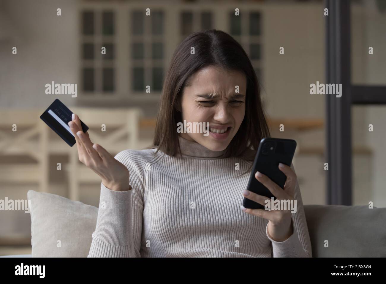 Concerned shopper girl having problems with online payments Stock Photo ...