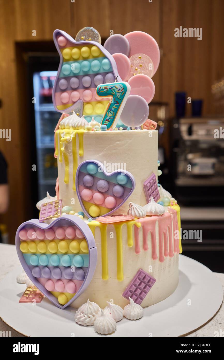 Pastel pink baby Birthday Cake with Sprinkles decor and candles. 7 ...