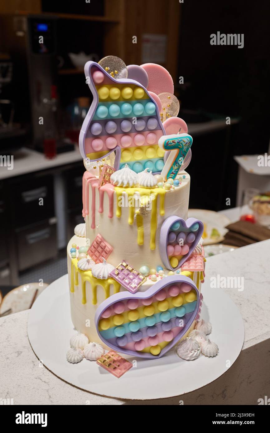 Pastel pink baby Birthday Cake with Sprinkles decor and candles. 7 ...