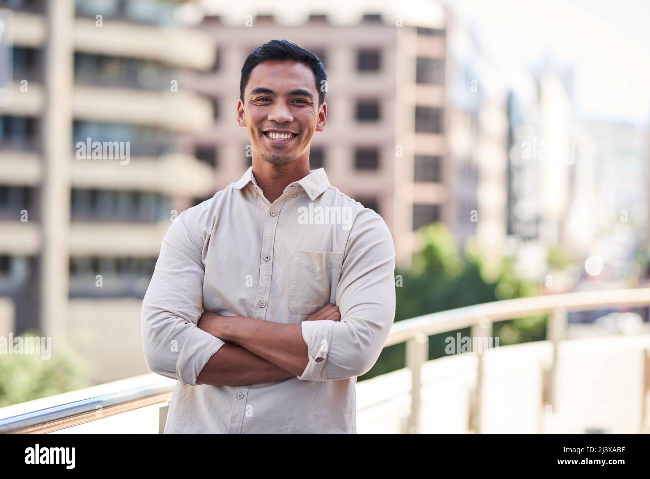 Cheerful asian man stands hi-res stock photography and images - Alamy