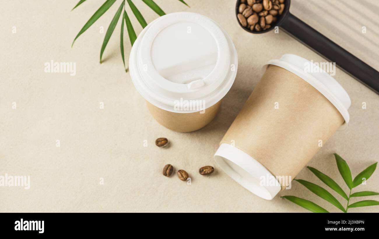 Coffee to go. Two disposable eco-friendly cardboard cups with coffee ...