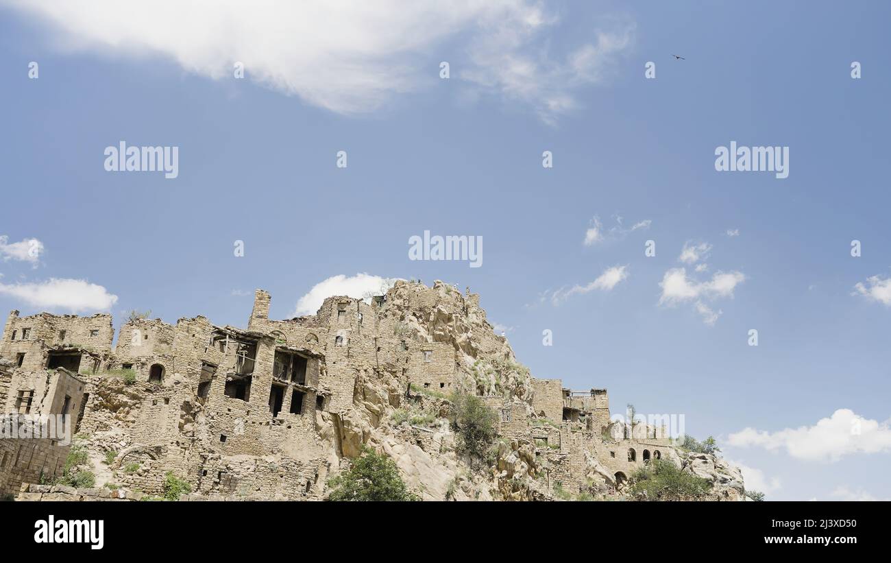 Ancient stone city in mountains in summer. Action. Beautiful landscape ...