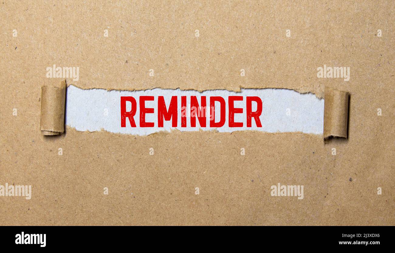 word REMINDER on torn paper Stock Photo - Alamy