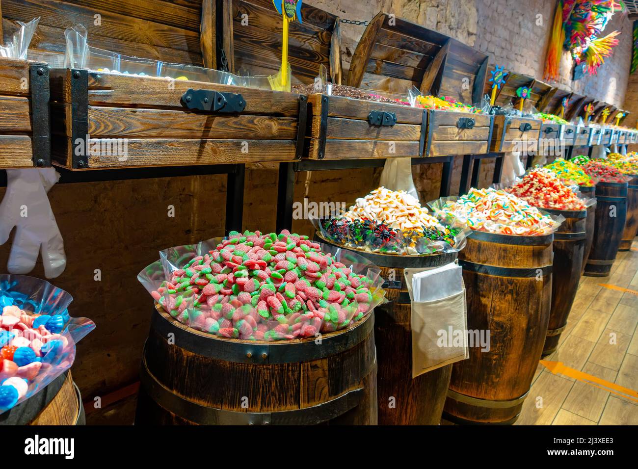 Jelly candies. Set of gummy candies in wooden barrels Stock Photo - Alamy