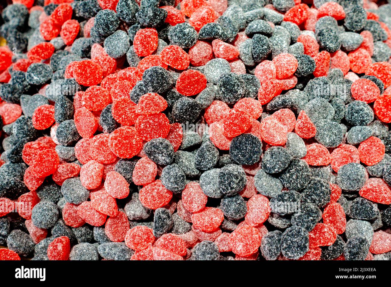 Jelly candies. Black and red candies Stock Photo - Alamy
