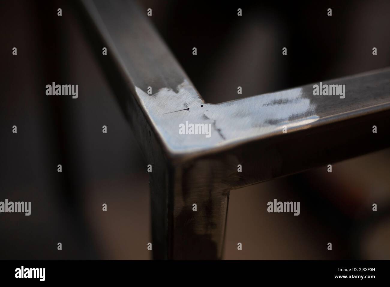 Steel angle. Molded seam on details. Scraped metal. Peeking corner of ...