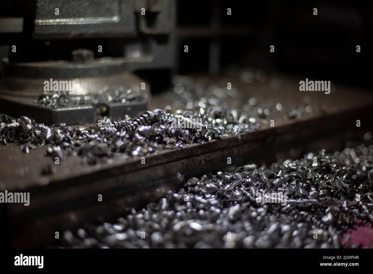 Metal shavings. Production waste. Steel chips after drilling. Garbage ...