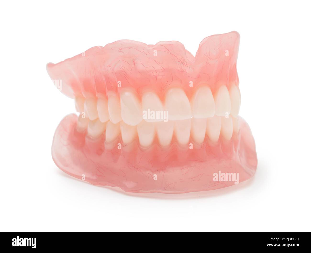 Dental new modern dentures isolated on white. Side view Stock Photo - Alamy