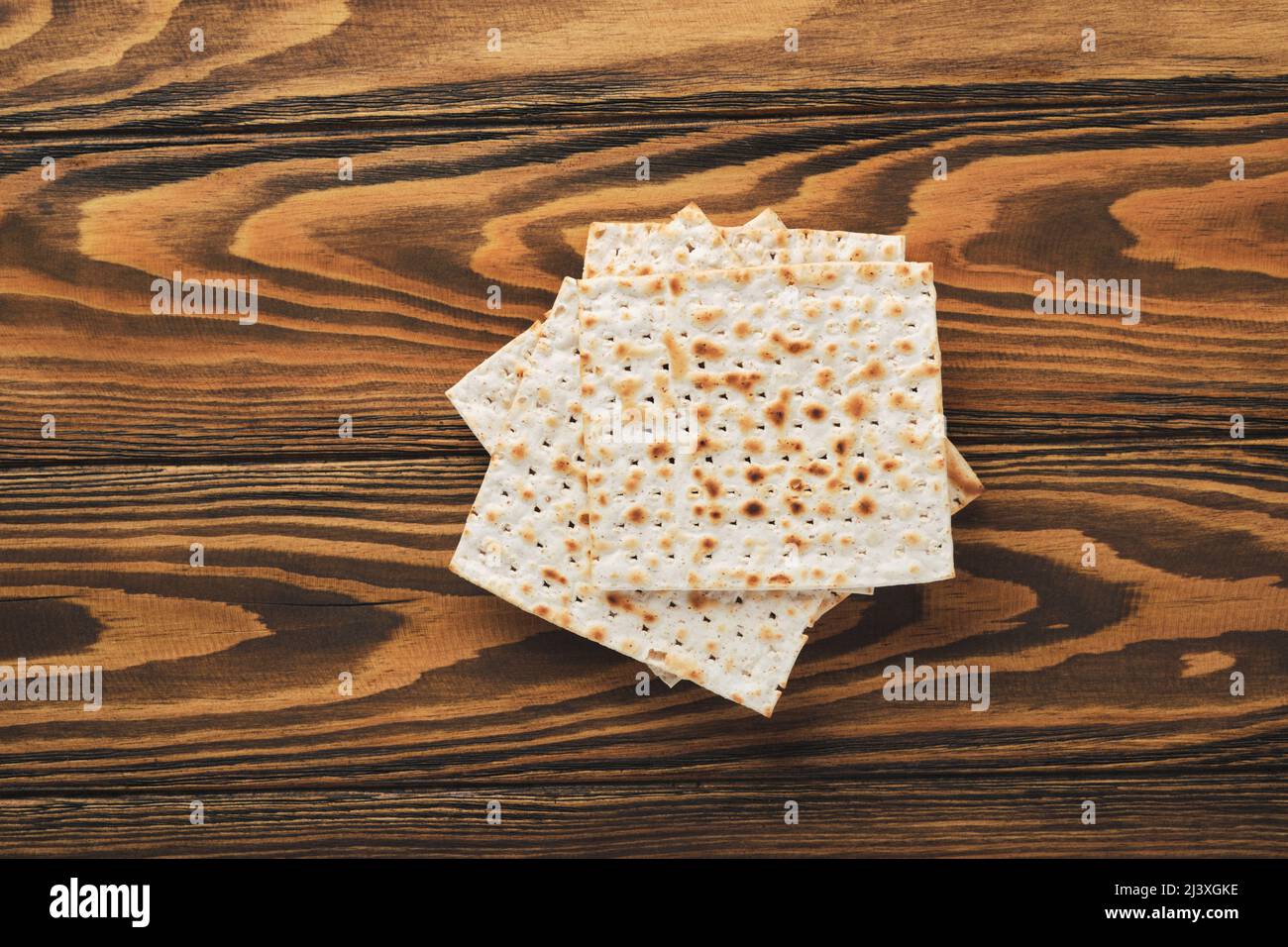 Passover celebration concept. Matzah, red kosher and walnut ...
