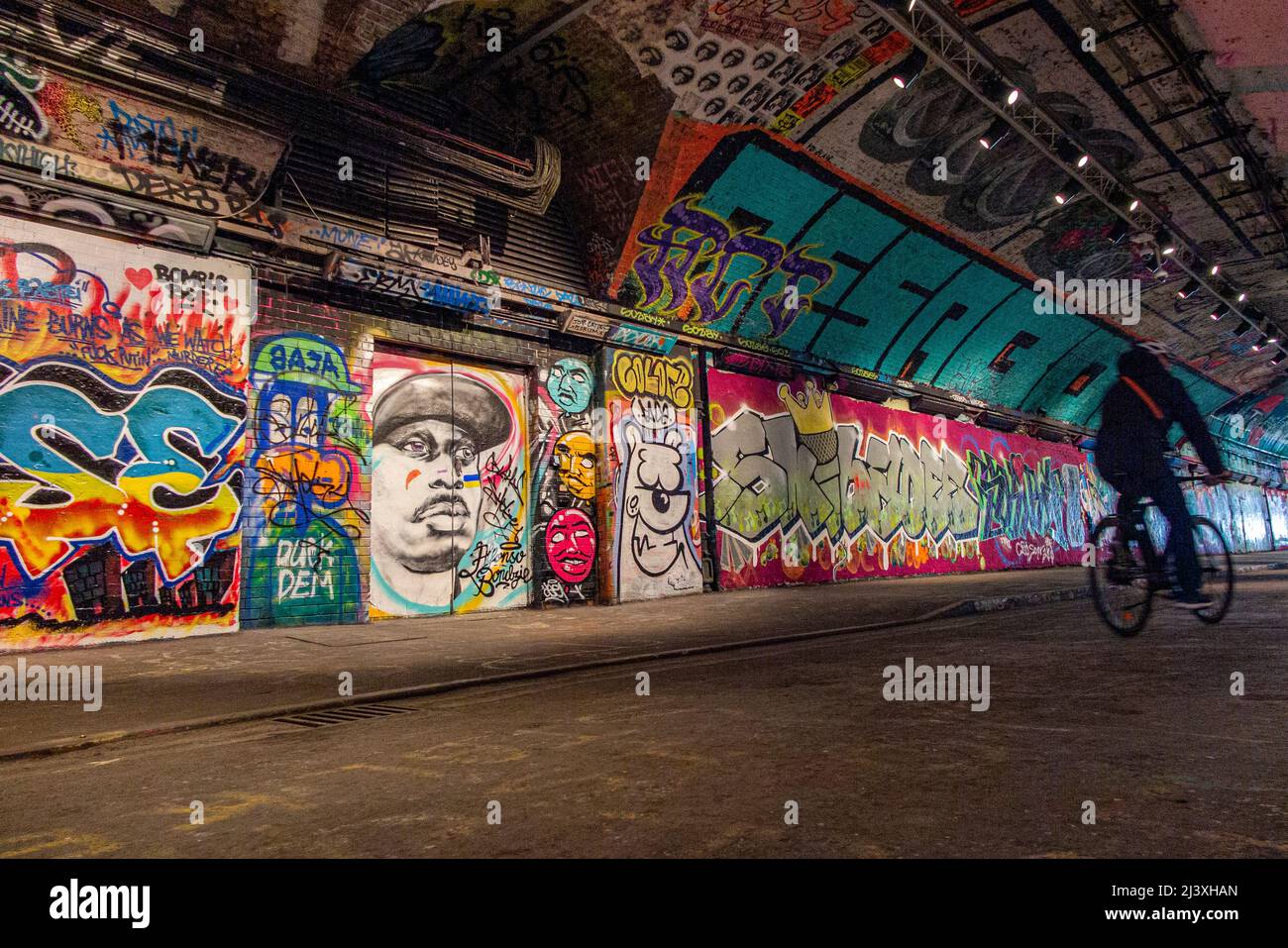 Cyling through Leake Street railway arch tunnel, Waterloo, London Stock ...