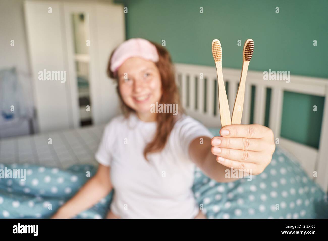 Morning routine. Young pretty woman wake up at home. Bed time. Snooze ...