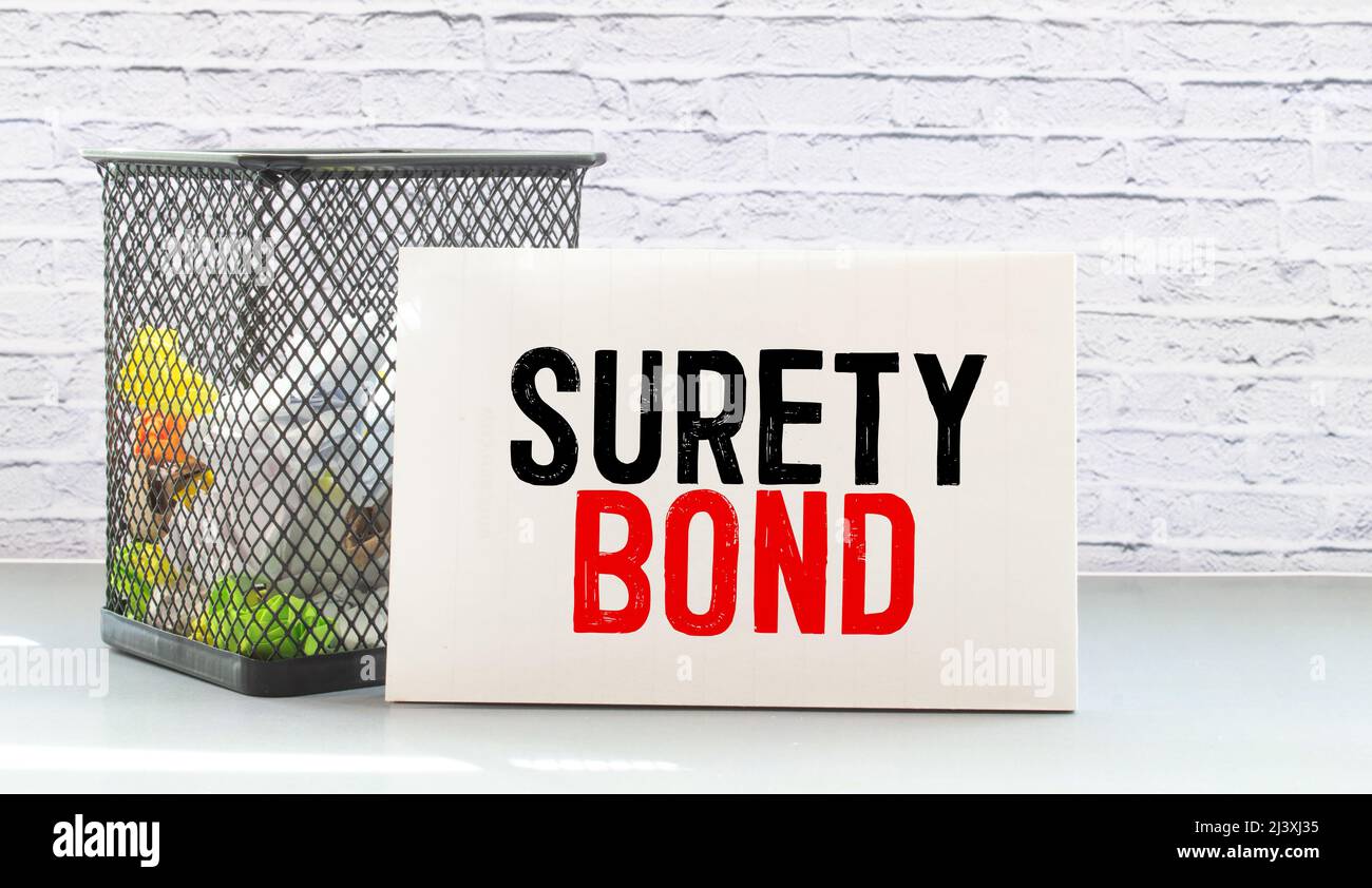 Paper with Surety Bond on table with chart . Business concept Stock ...