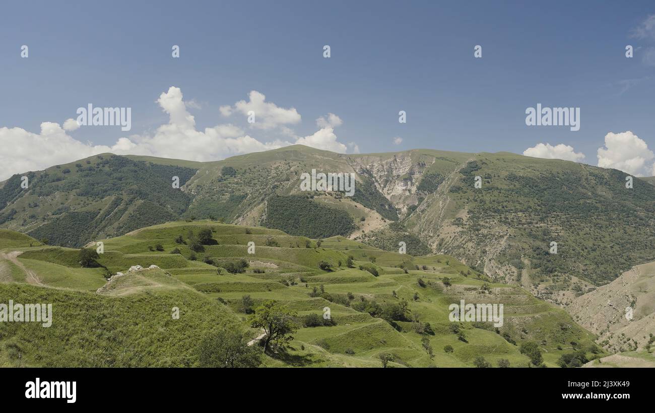 Top view of green mountain valley on sunny day. Action. Beautiful ...