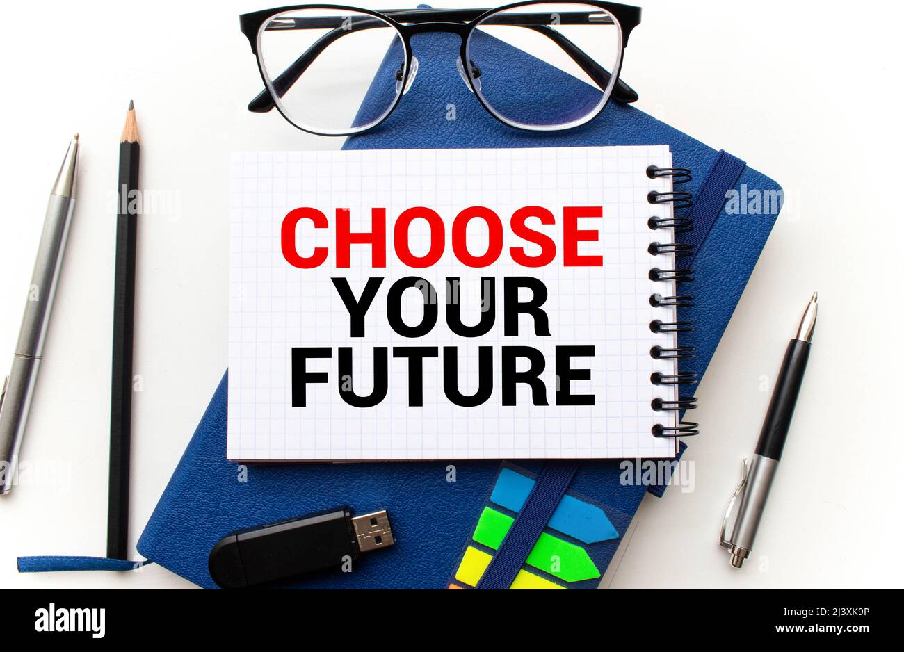 Flat lay composition with words CHOOSE YOUR FUTURE, computer keyboard ...