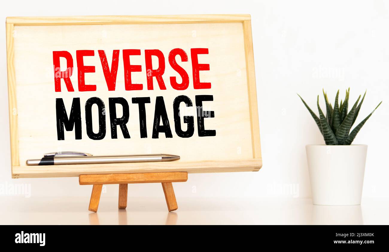Reverse mortgage form on a table and money Stock Photo - Alamy