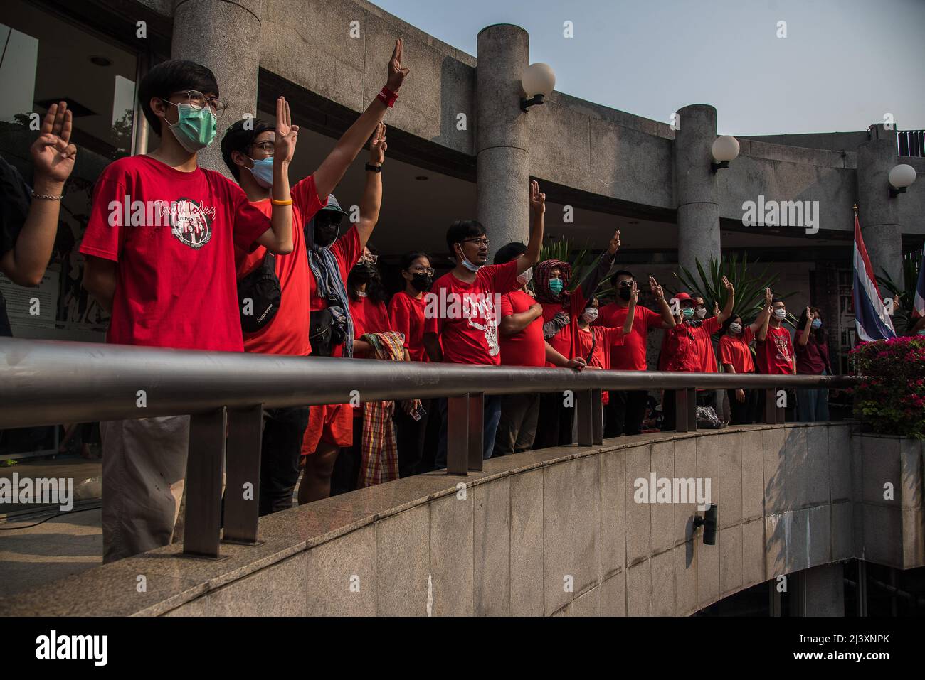 Protesters make three finger salute during the anniversary. Former core ...