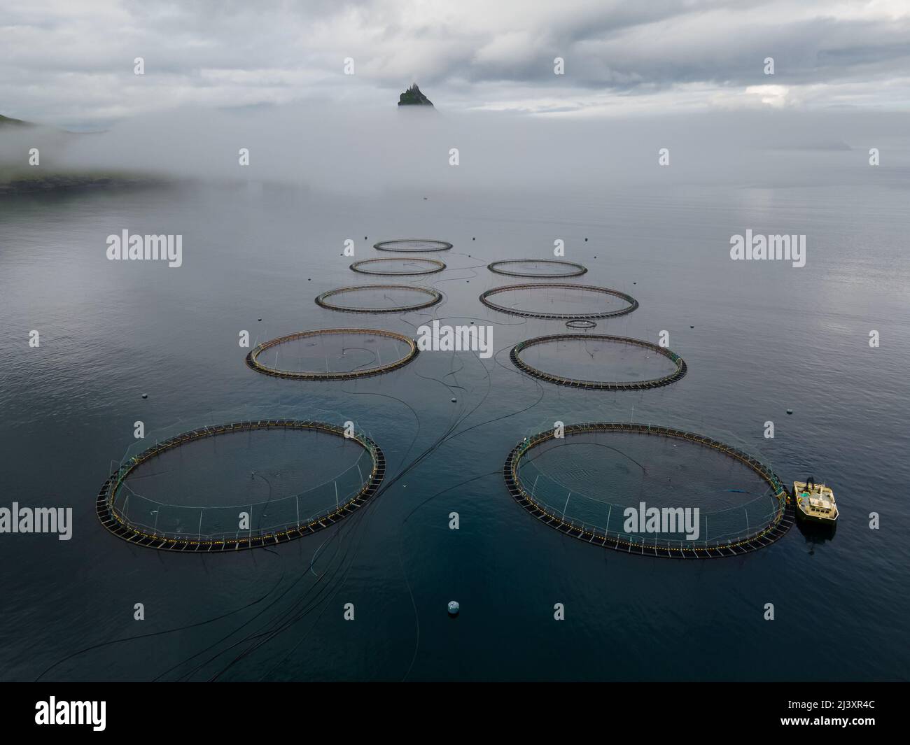 Beautiful cinematic aerial footage of the Salmon fishing farm pools and ...