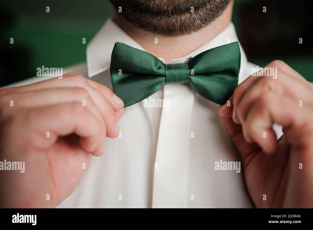 Green bow tie around the neck of a man. Wedding Stock Photo - Alamy