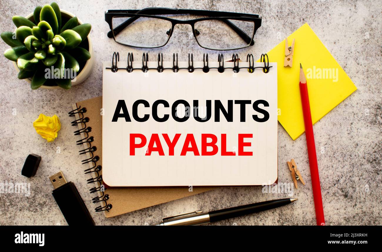 Notebook writing account payable,modern Office table with laptop Stock ...