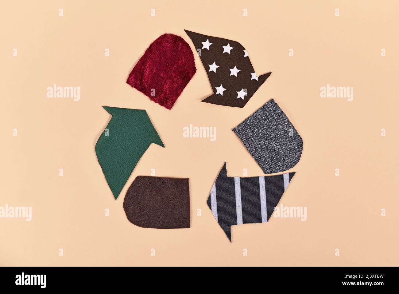 Recycling arrow symbol made from old textile pieces Stock Photo - Alamy