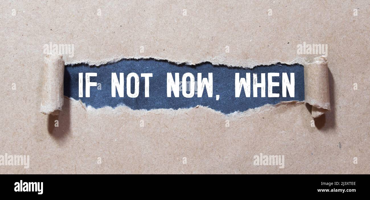 If Not Now When, appearing behind torn brown paper Stock Photo - Alamy