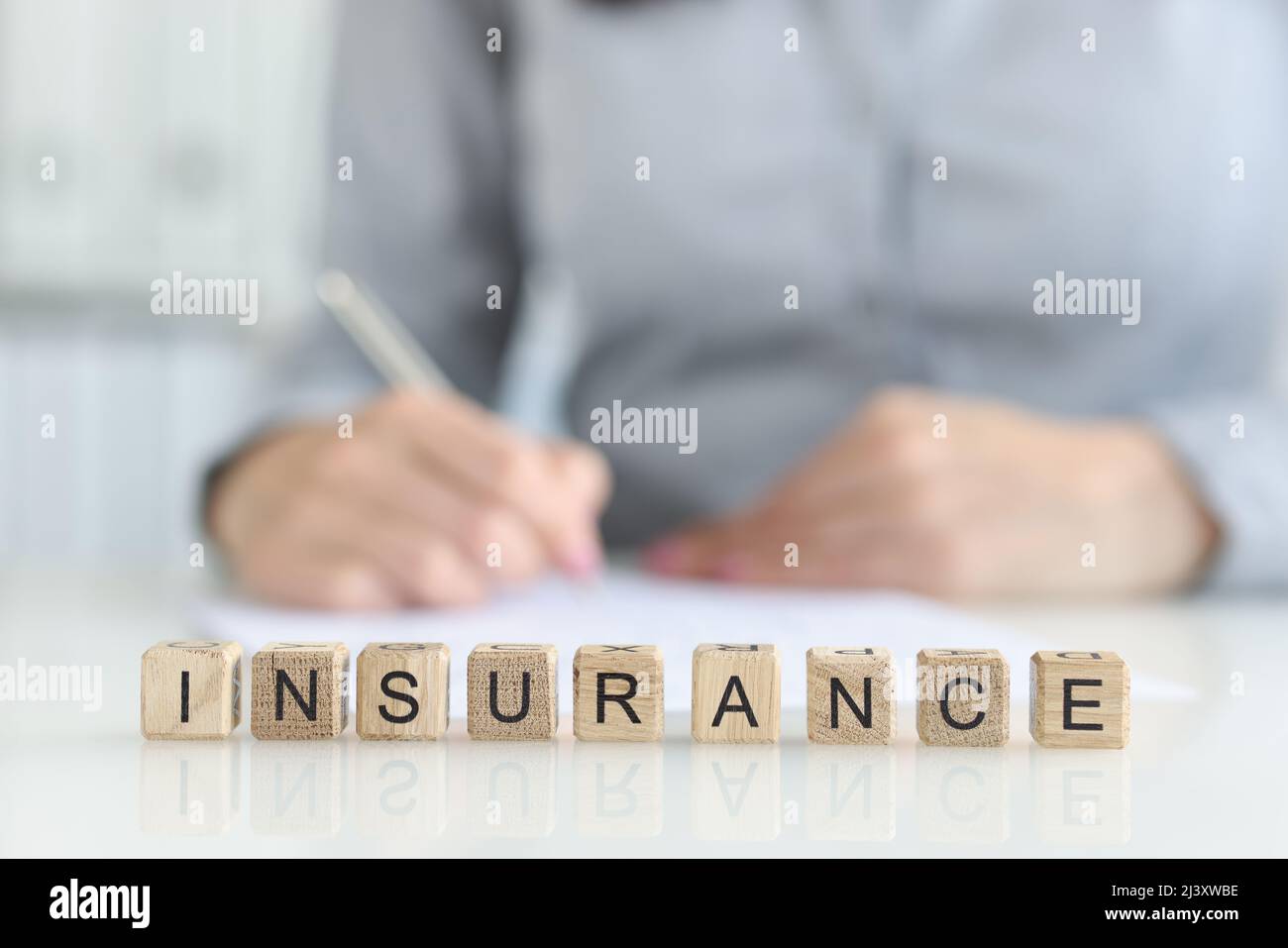 Insurance agent fills out insurance form in office closeup Stock Photo ...
