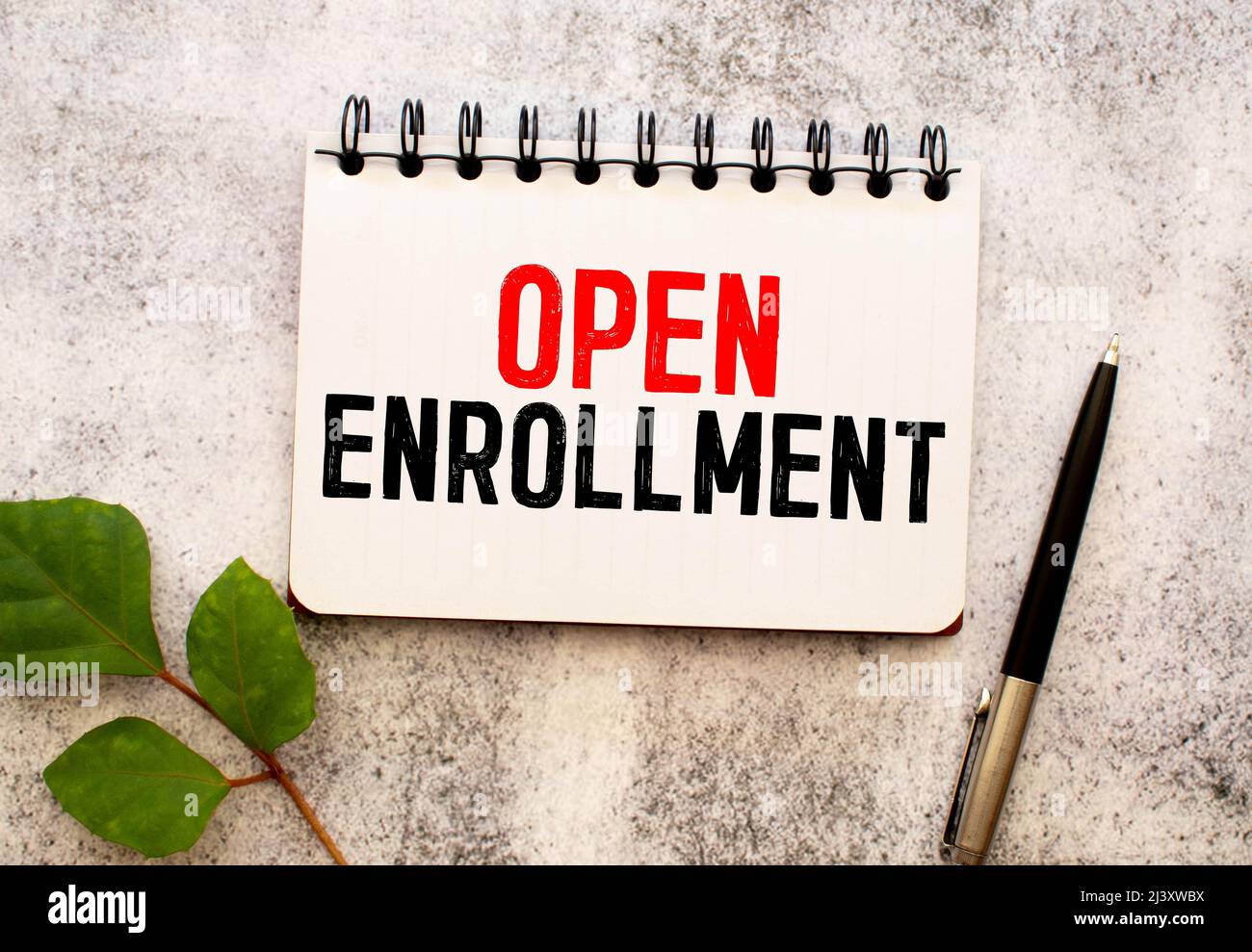 Open Enrollment - doctor holding chalkboard with text Stock Photo - Alamy
