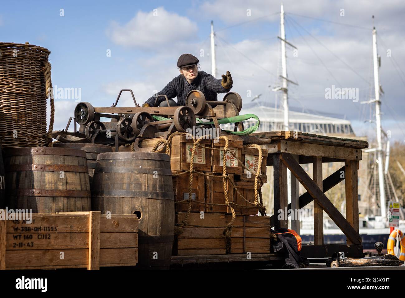 Man in period labourers costume unloading WW2 vintage Bristol Road ...