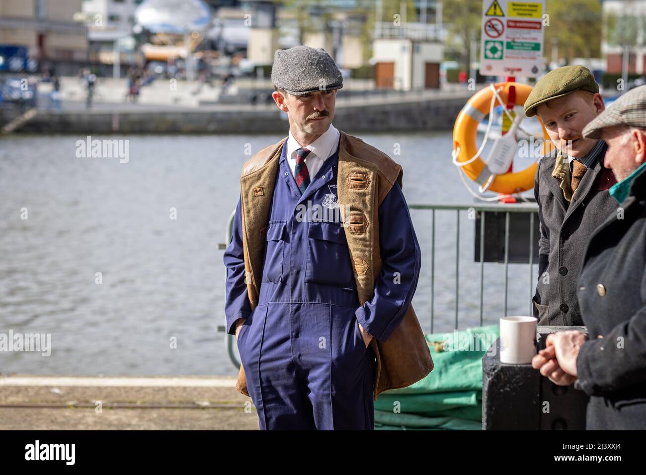 Man dressed in 1940s vintage dockland superviser costume with mosutache ...