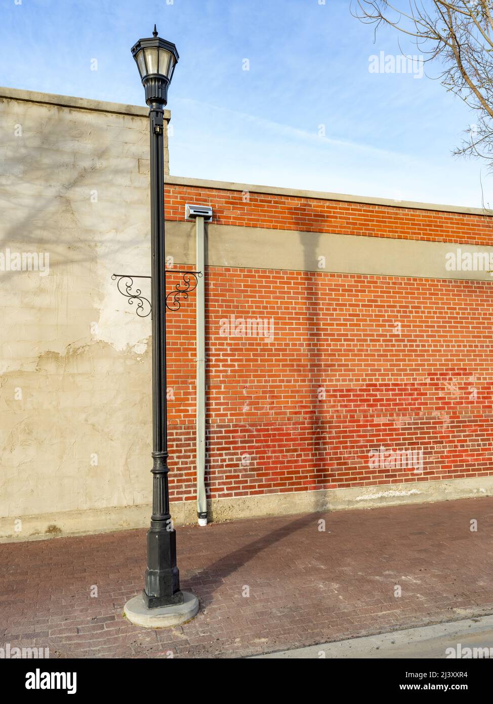 City building made of brick with light pole Stock Photo - Alamy