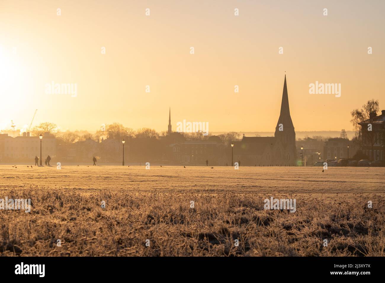 A view of Blackheath Common in the winter during a warm sunset. All ...