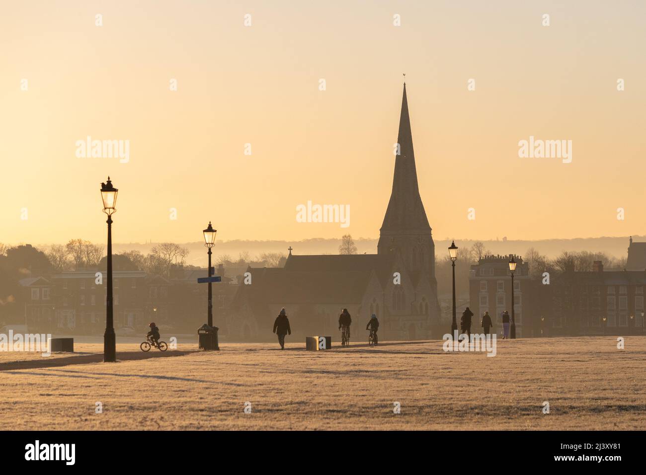 A view of Blackheath Common in the winter during a warm sunset. All ...
