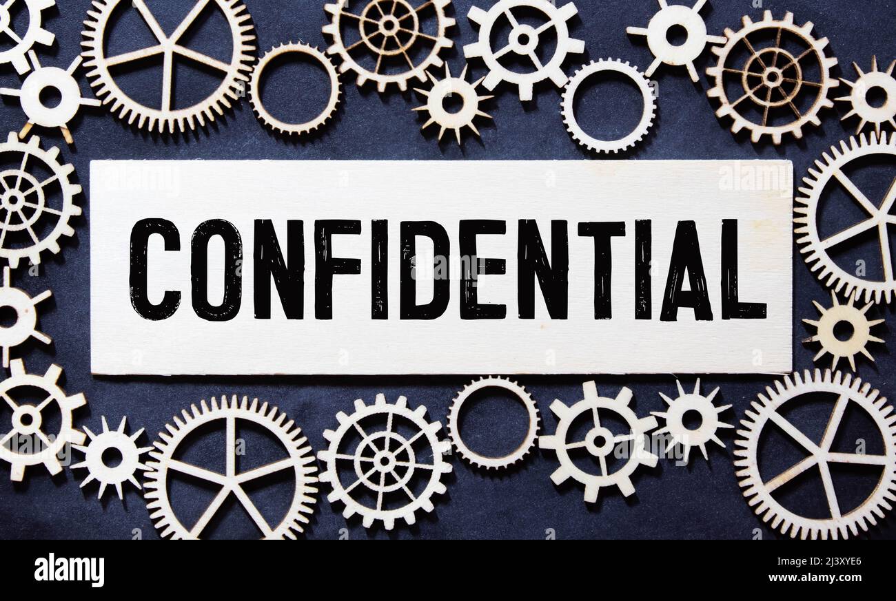 CONFIDENTIAL text on the business card, amid the reports. A business ...
