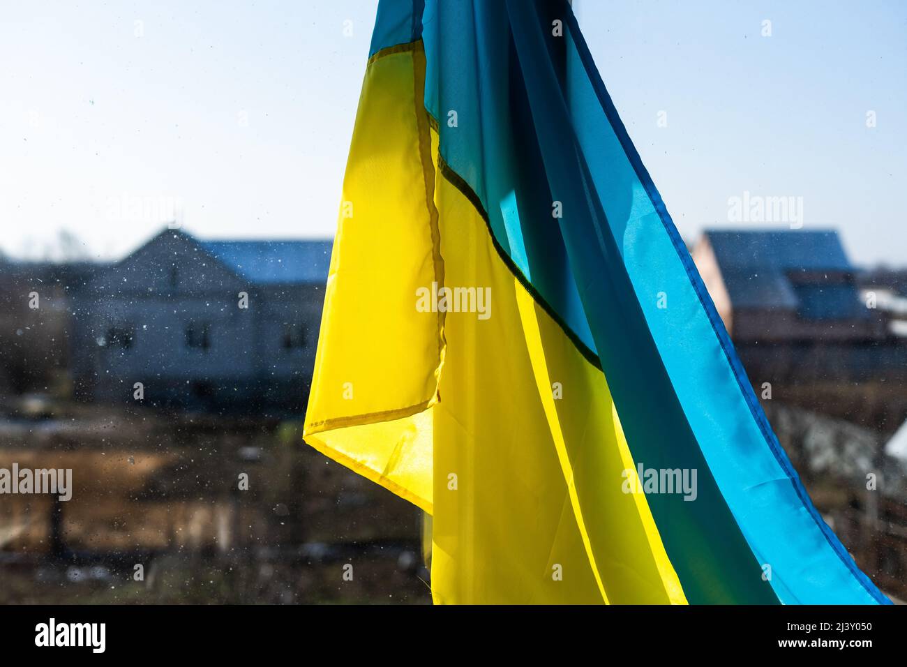Support Ukraine. Ukrainian flag on the window. Place for text Stock ...