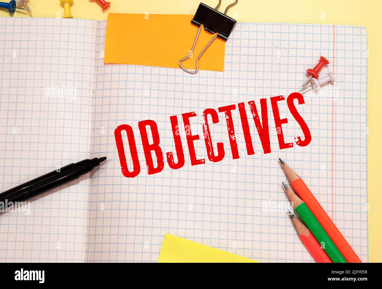 Paper with text objective on wood table Stock Photo - Alamy