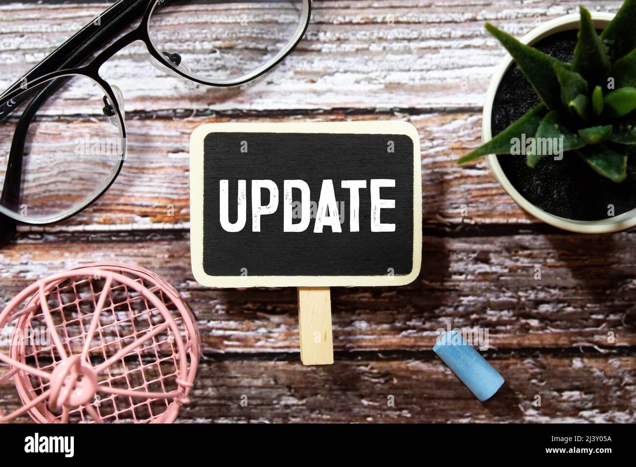 Update text on small chalk board and light background Stock Photo - Alamy